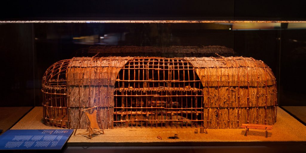 Model representing an Iroquoian longhouse covered with bark. Some parts ...